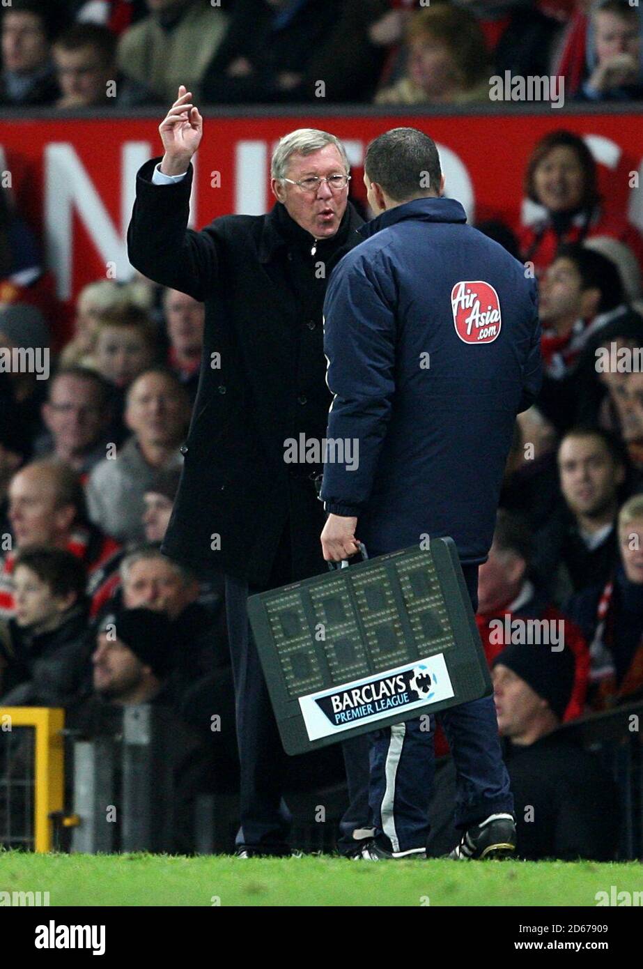 Manchester United manager Alex Ferguson (left) argues with the fourth ...