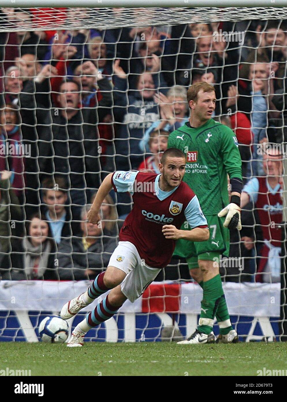 Burnley's Martin Paterson runs to celebrate scoring their third goal ...