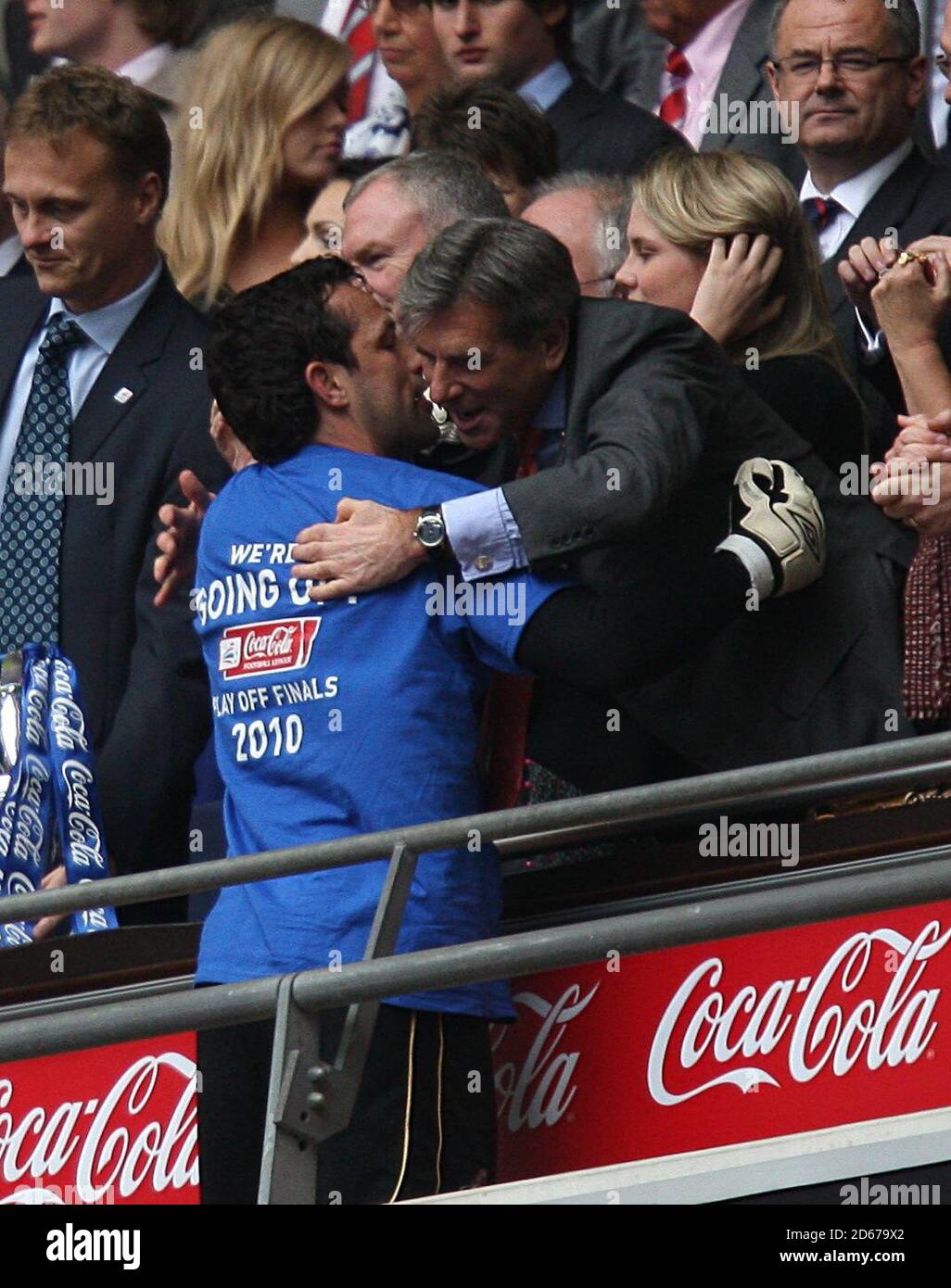 Millwall's David Forde (left) hugs the club's chairman John Berylson ...