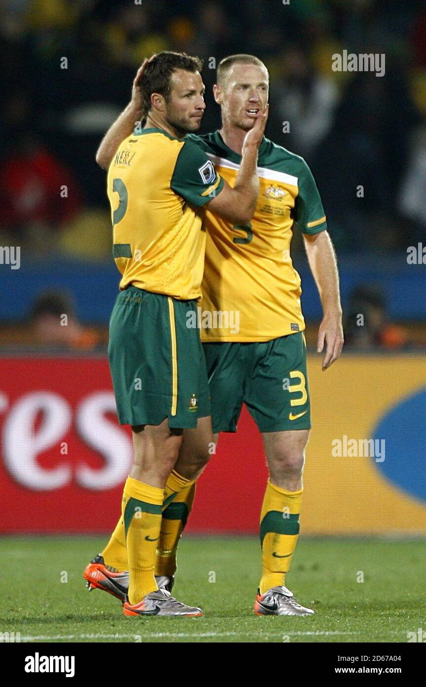 Australia' Craig Moore (right) and Lucas Neill congratulate each other ...