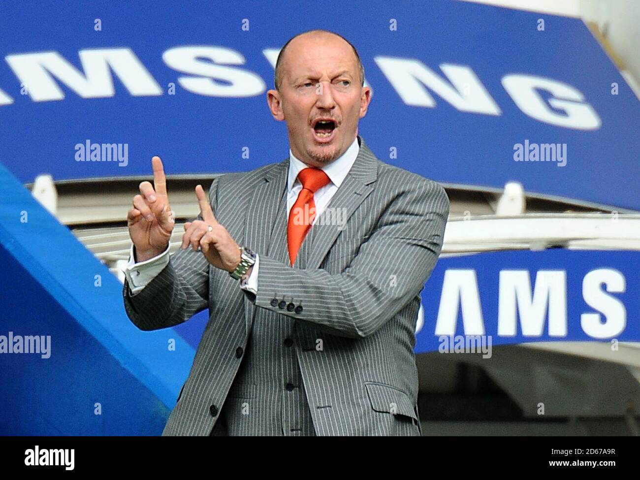 Blackpool manager Ian Holloway gives instructions from the touchline ...
