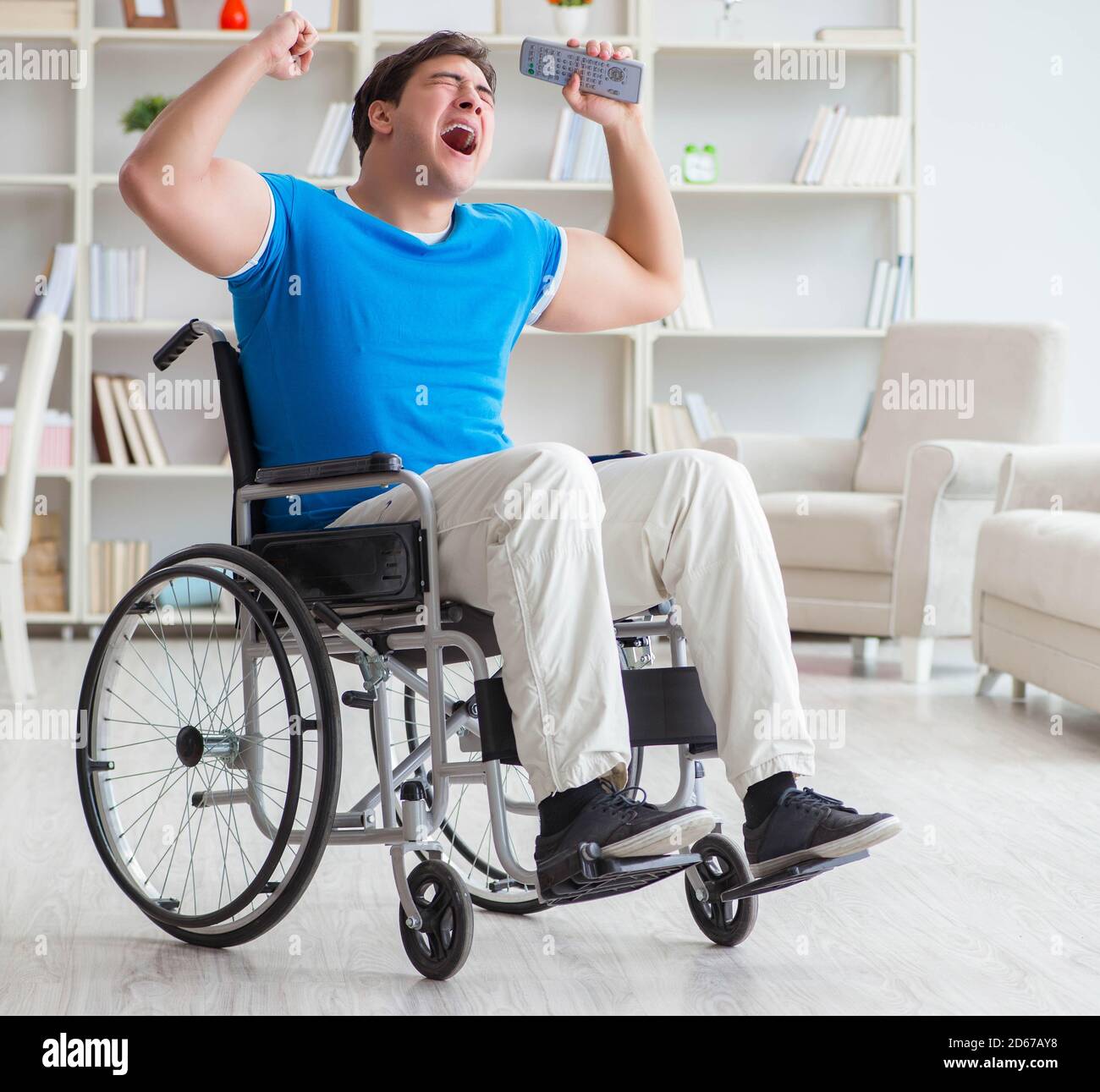 The disabled man watching sports on tv Stock Photo - Alamy