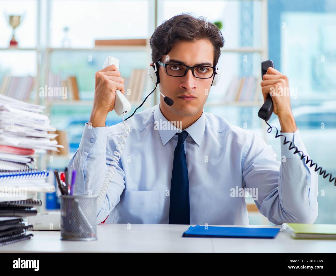 The unhappy angry call center worker frustrated with workload Stock ...