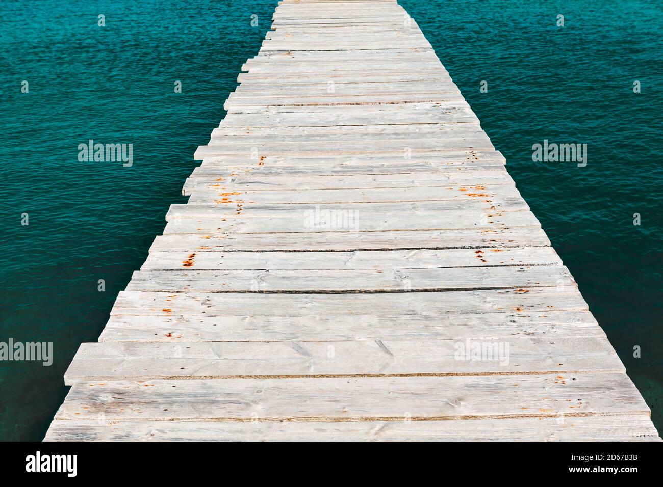 Wooden path over the water . Footbridge to the sea Stock Photo - Alamy