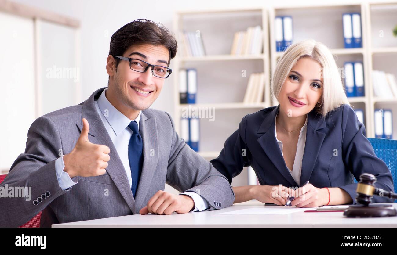 The lawyer discussing legal case with client Stock Photo - Alamy