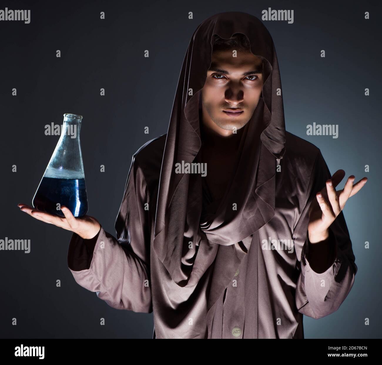The alchemist doing experiments in alchemy concept Stock Photo - Alamy