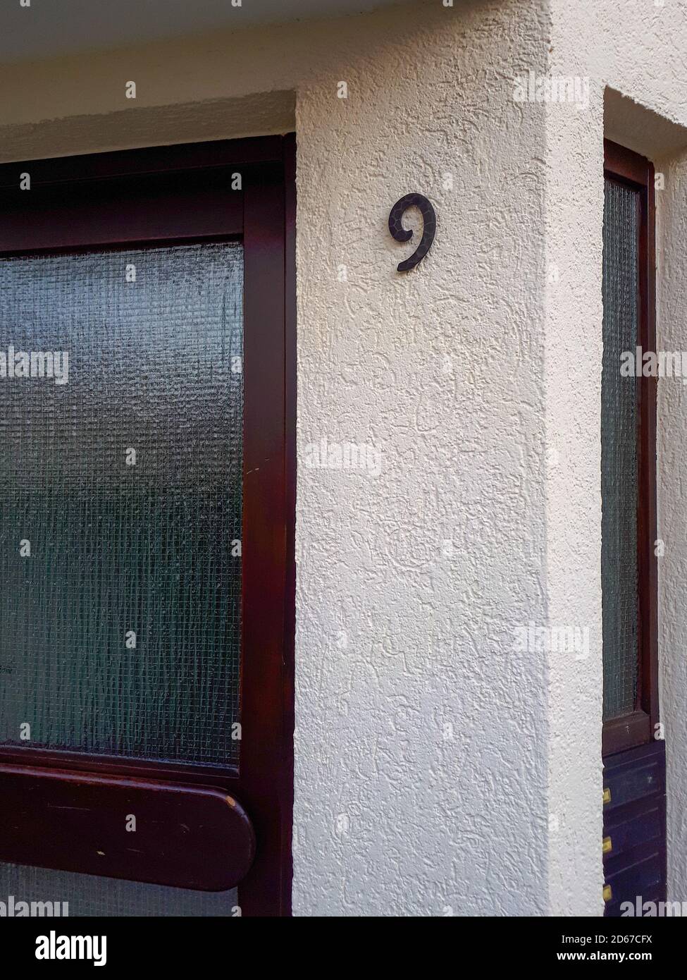 House number nine near the door Stock Photo - Alamy