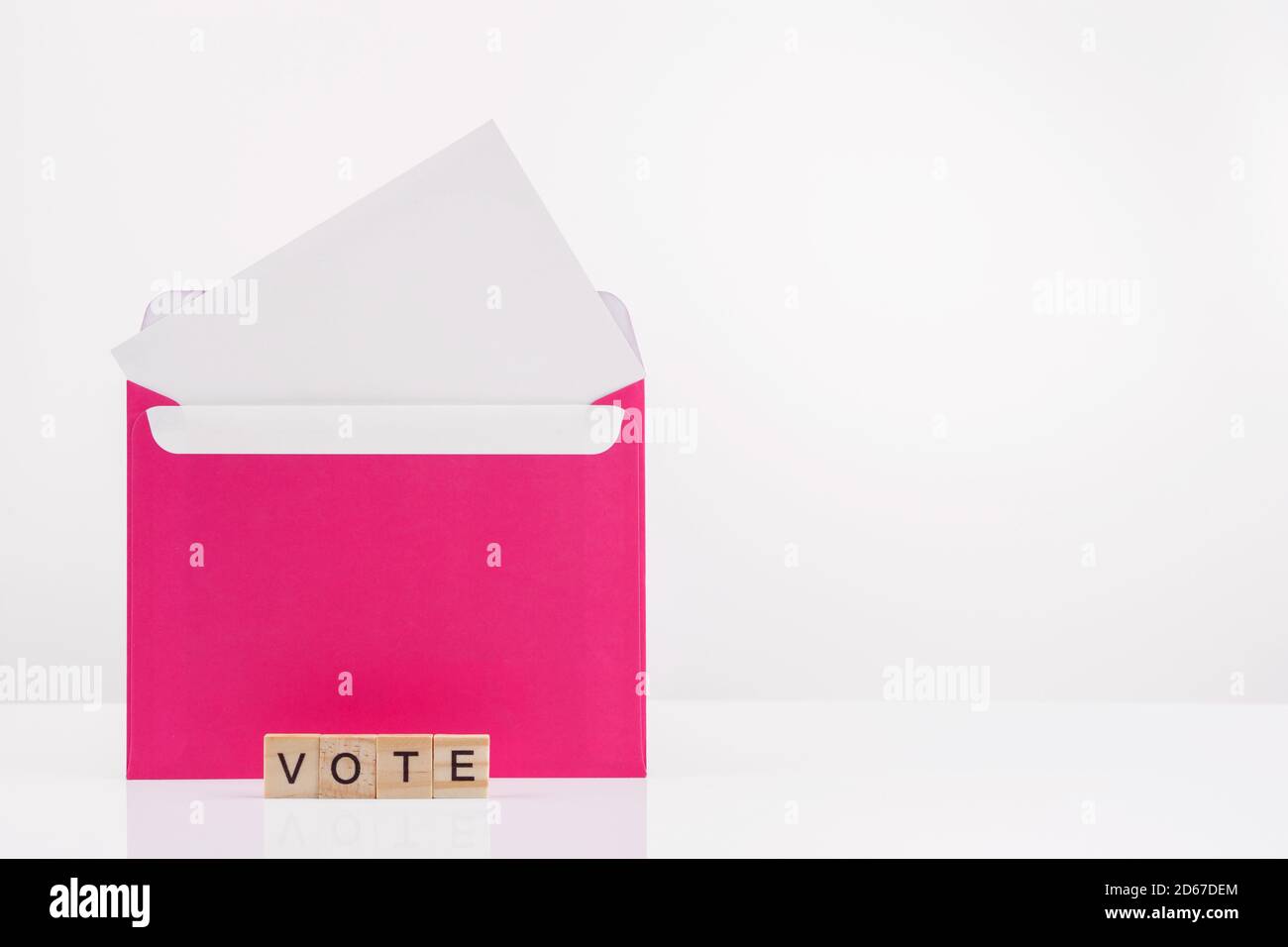 Mail voting concept. Envelope with ballot paper on a white background ...