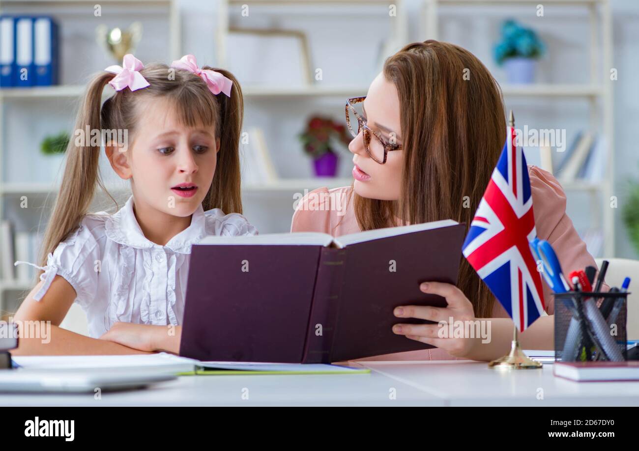 The young girl learning english with teacher Stock Photo - Alamy