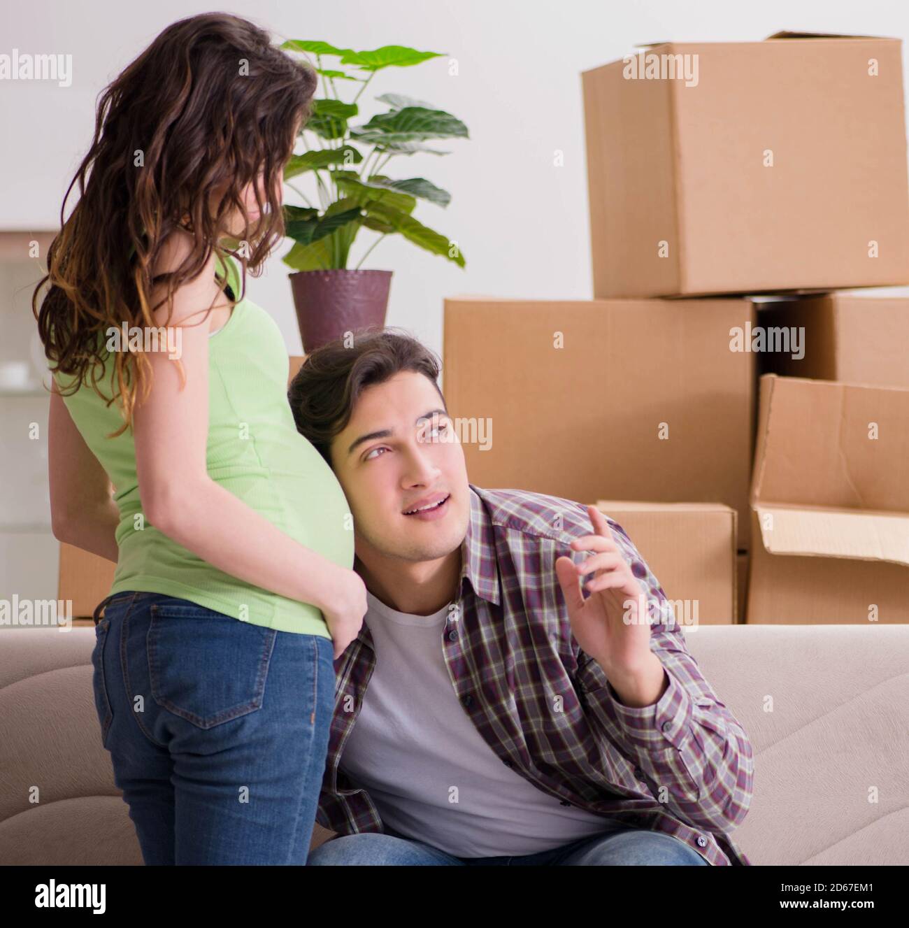 The young couple of man and pregnant wife expecting baby Stock Photo ...