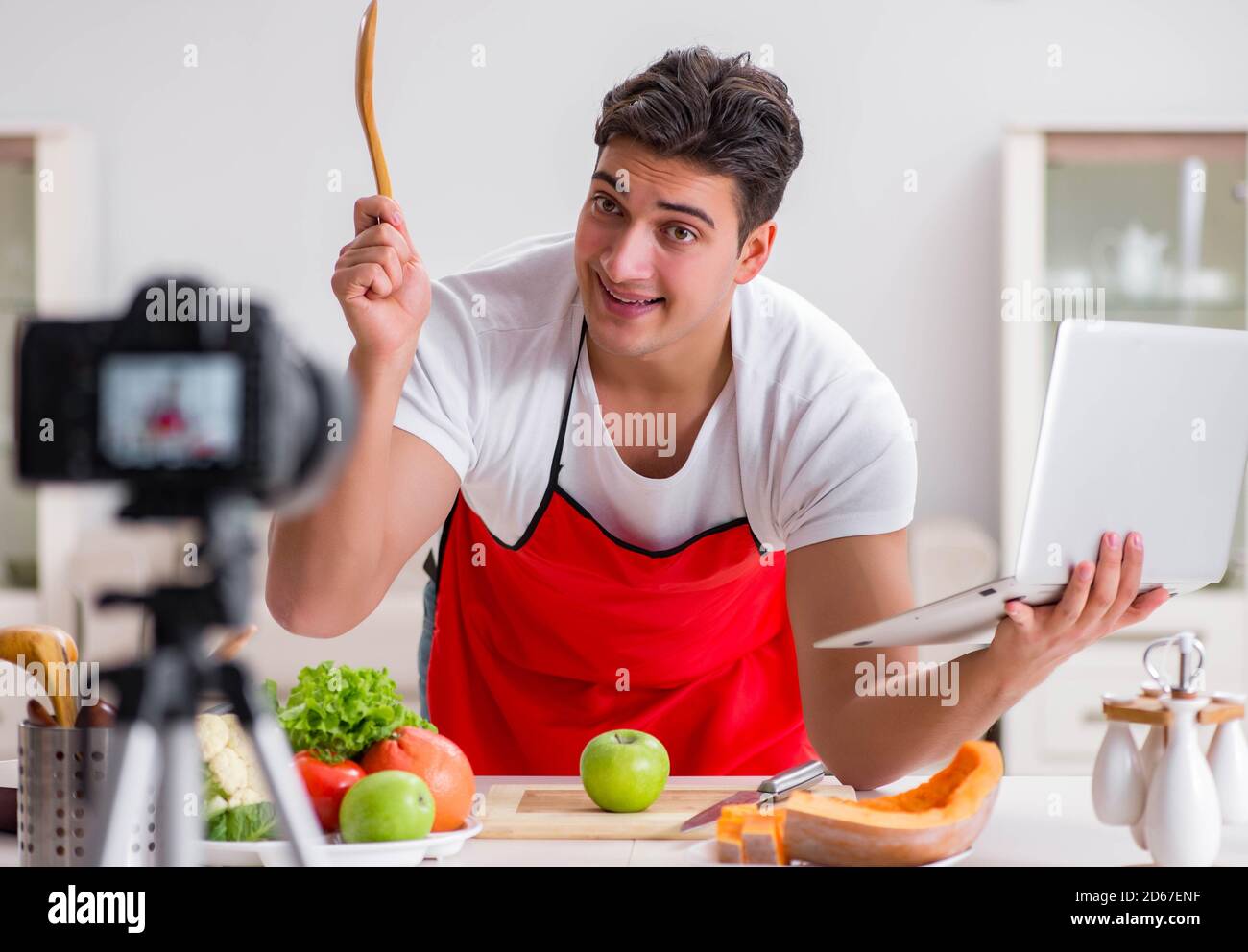 The food blogger working in the kitchen Stock Photo - Alamy
