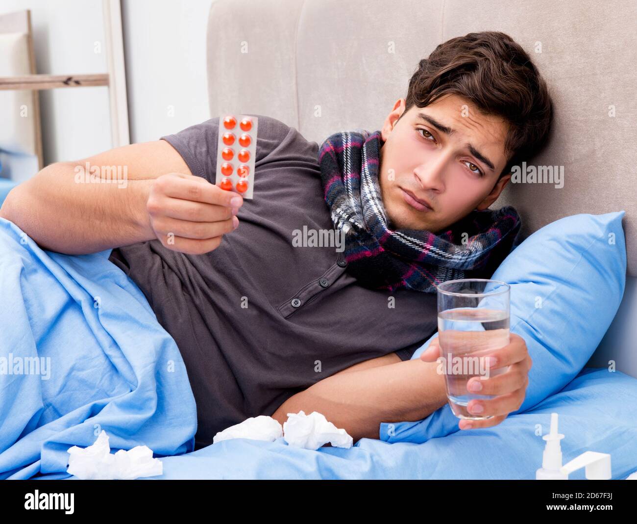 The sick ill man in the bed taking medicines and drugs Stock Photo - Alamy