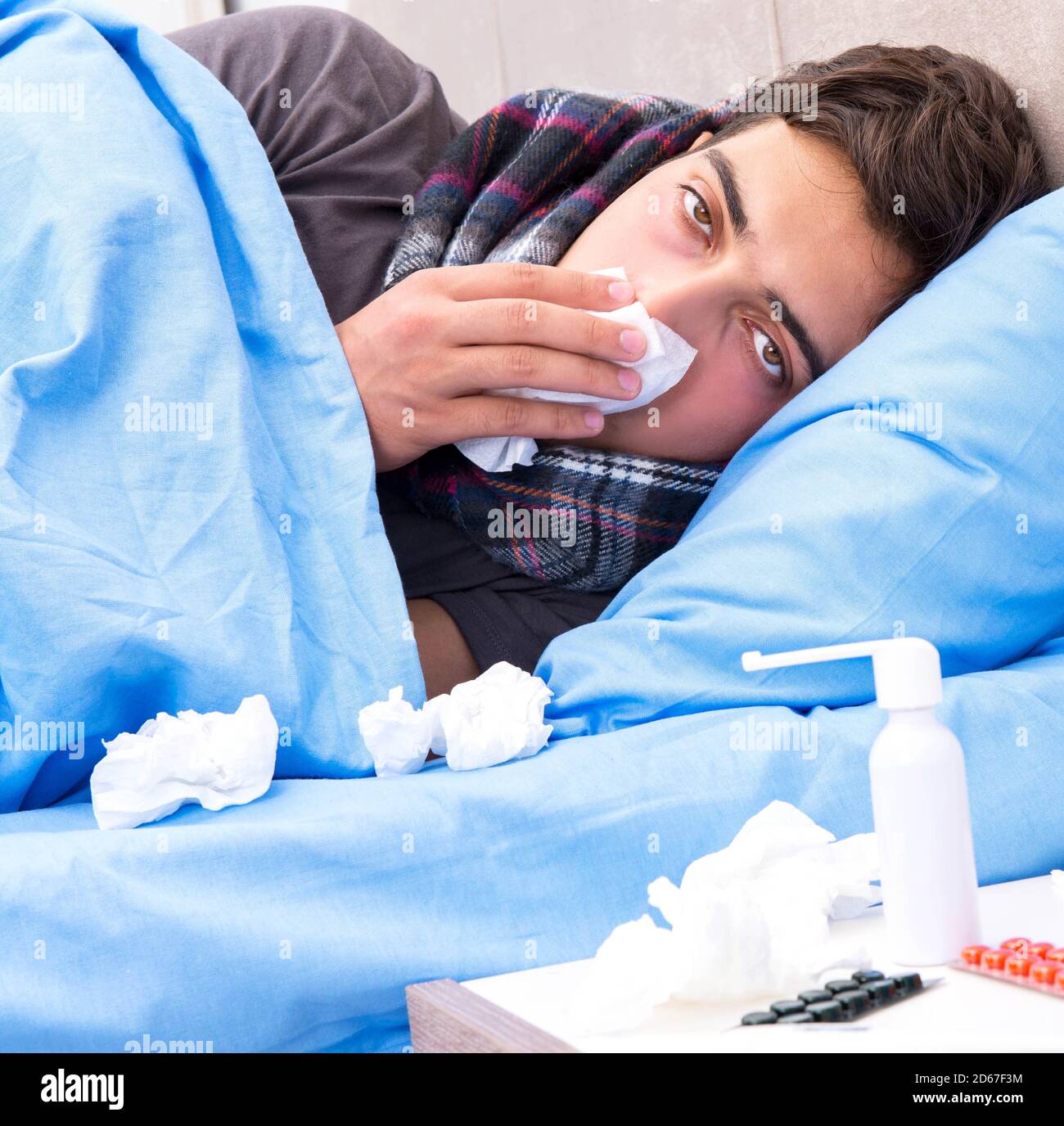 The sick man with flu lying in the bed Stock Photo - Alamy
