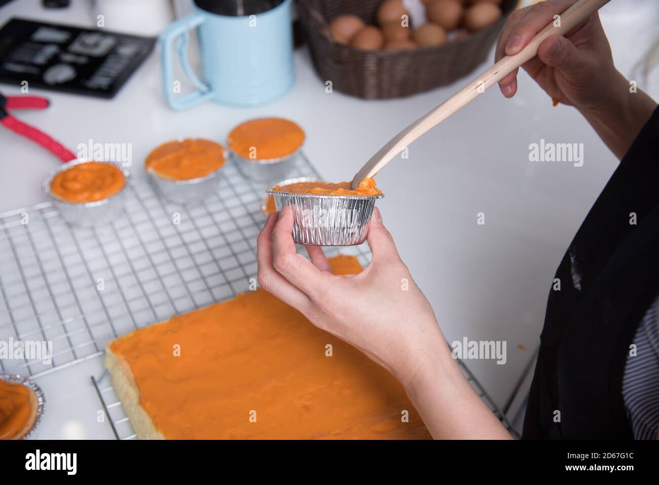 Woman during making decorating cooking bakery cake at homemade Stock ...