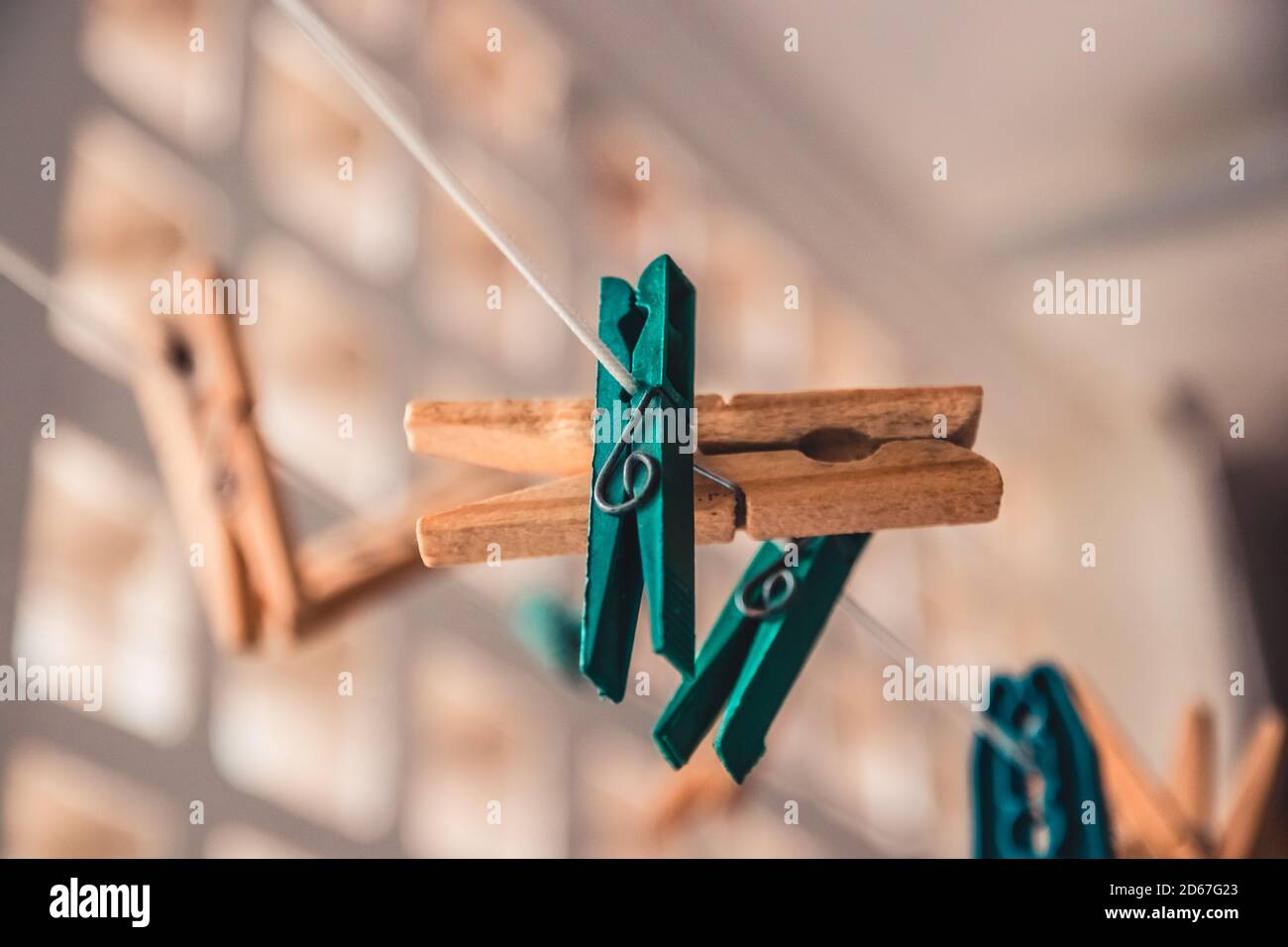 Clothespins holding clothes in laundry. clothes-peg on a string Stock ...