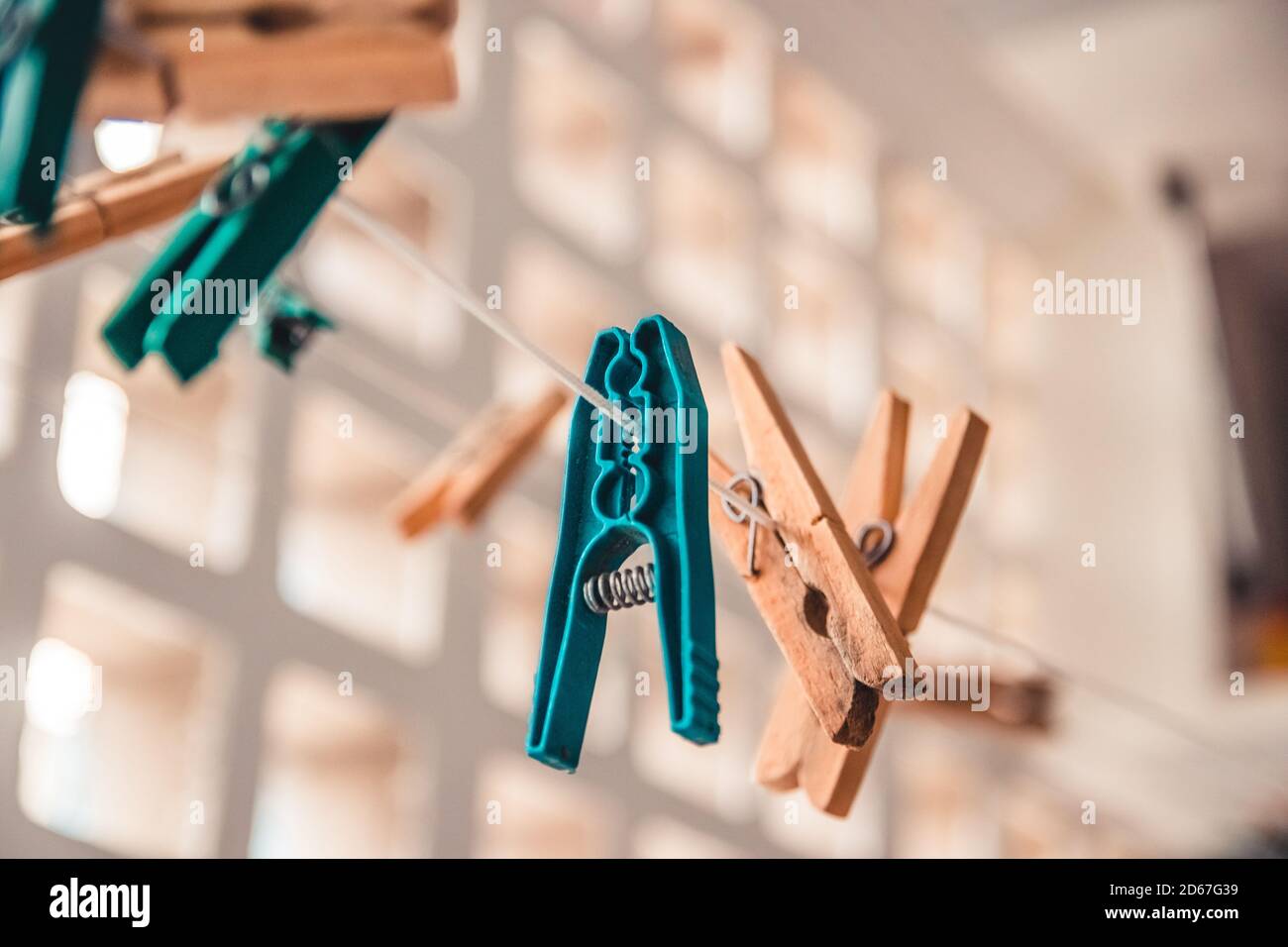 Clothespins holding clothes in laundry. clothes-peg on a string Stock ...