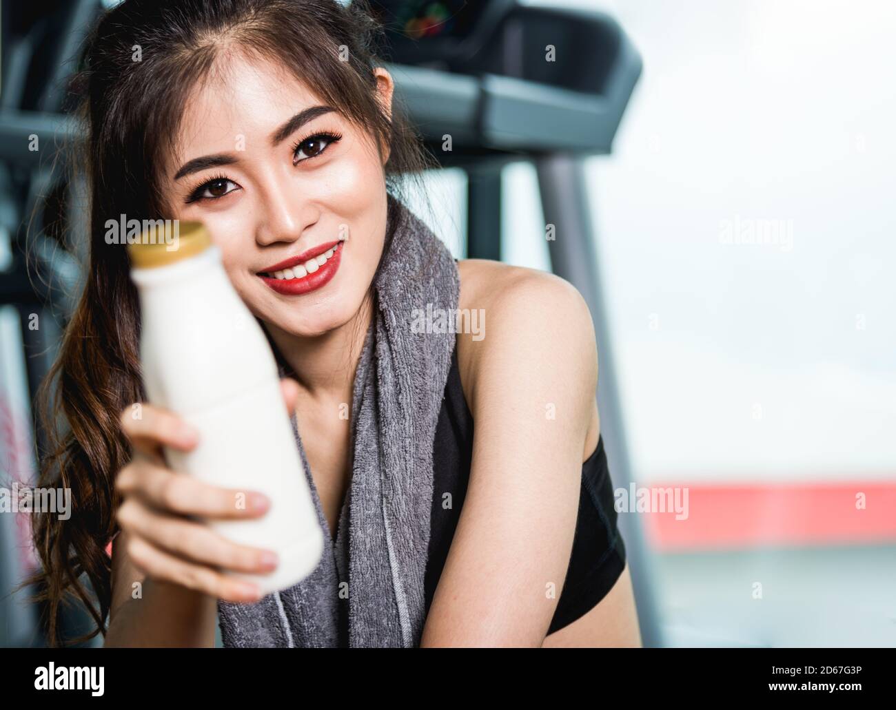 Woman lifestyle sitting shake milk after training exercise workout at ...