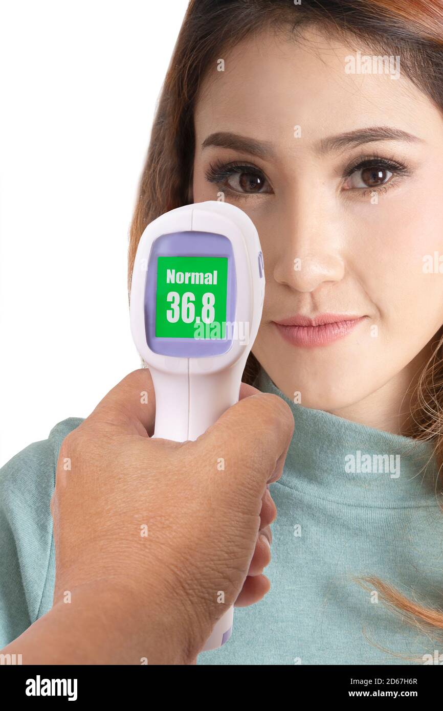 Hand Holding Digital Infrared Thermometer With Woman Face As Measuring