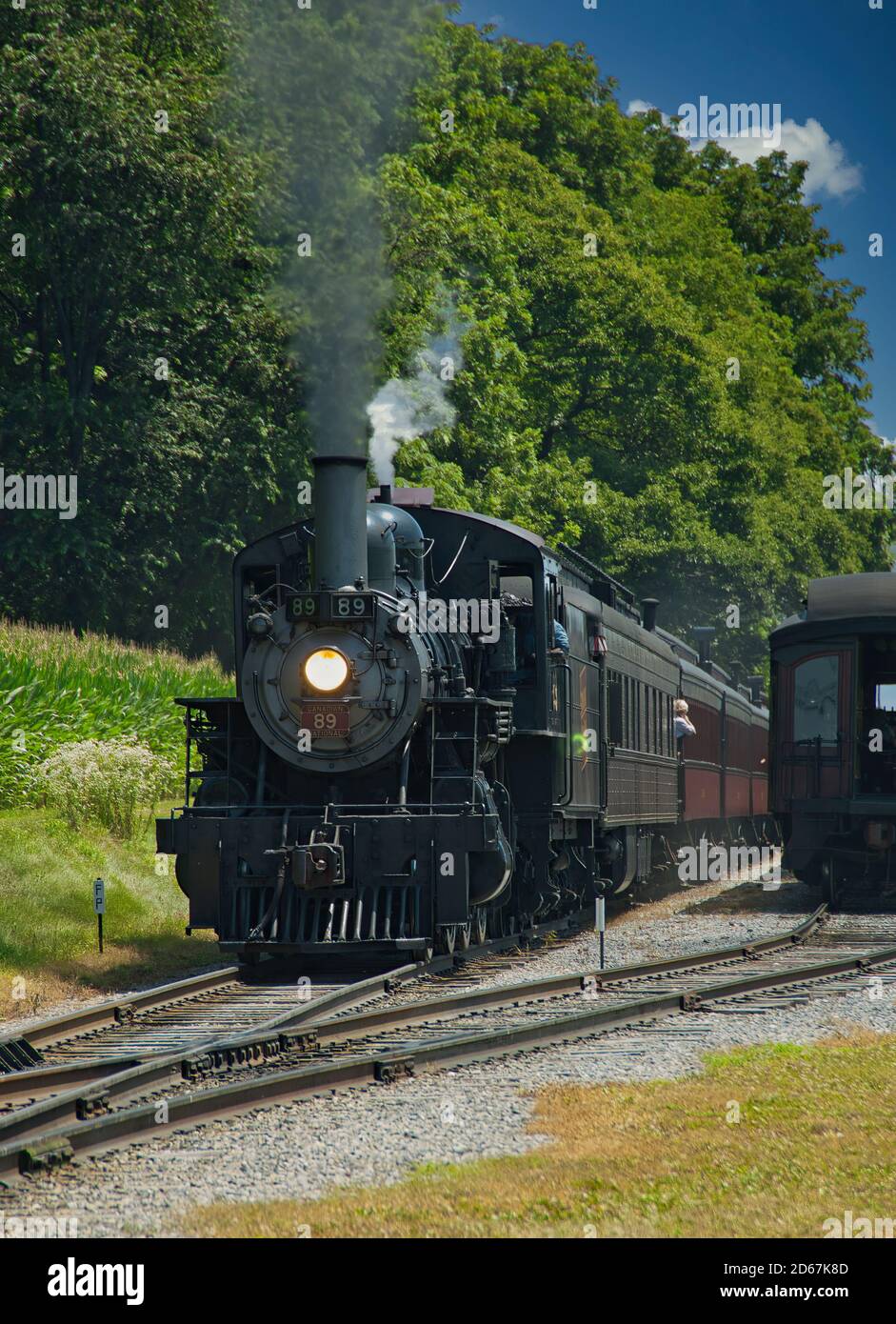 Restored Antique Steam Locomotive with Passenger Cars Steaming Up Stock ...
