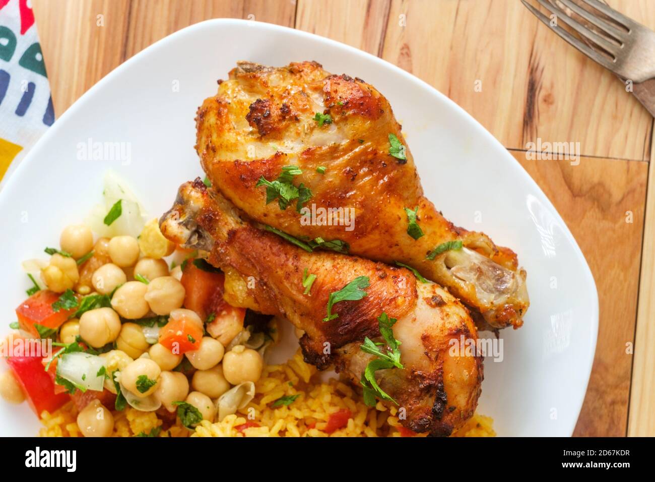 Portuguese piri piri chicken with chickpea salad and yellow rice Stock ...