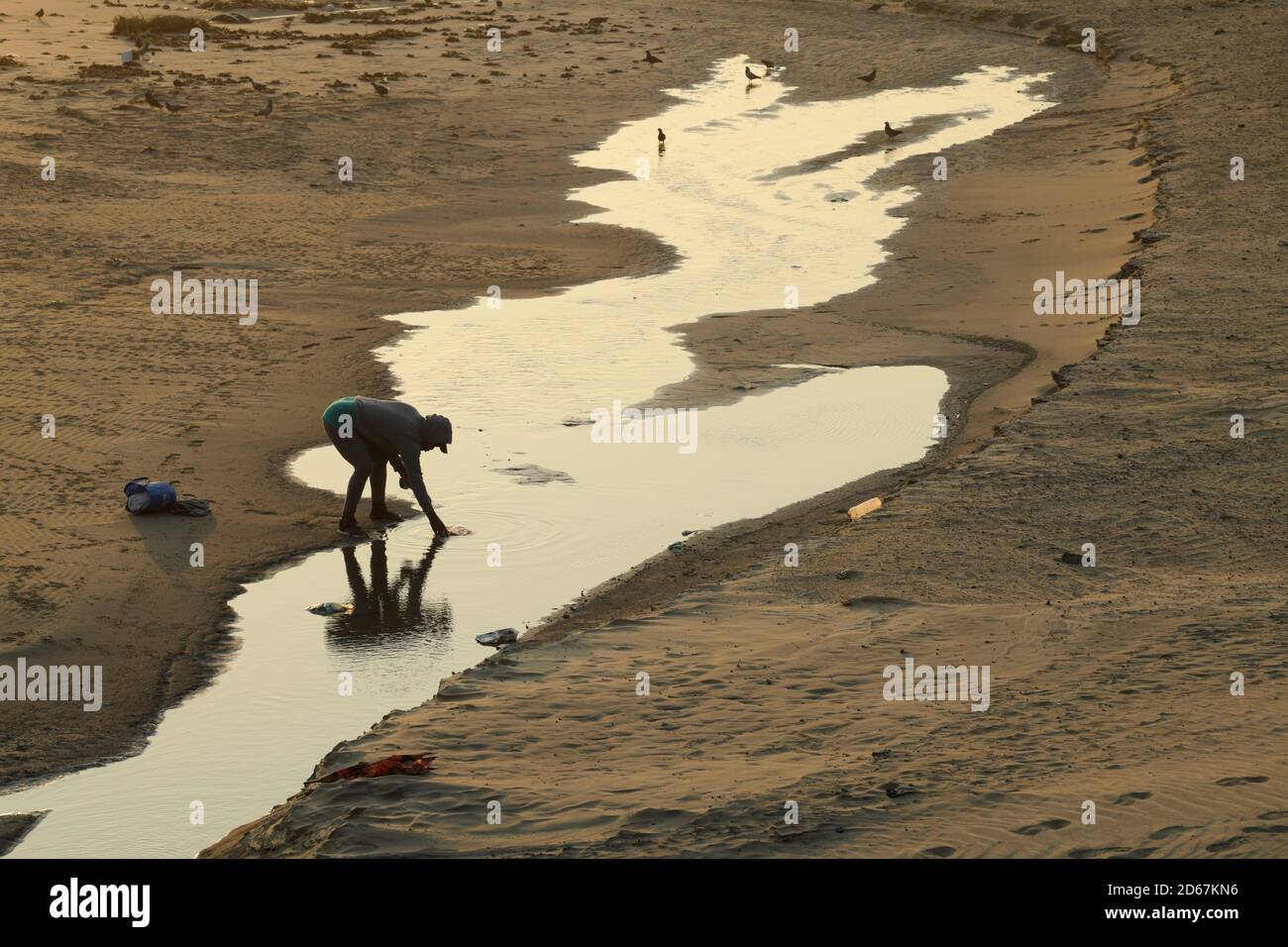 Adult woman washing in sewerage water, homeless person, poverty, Durban ...