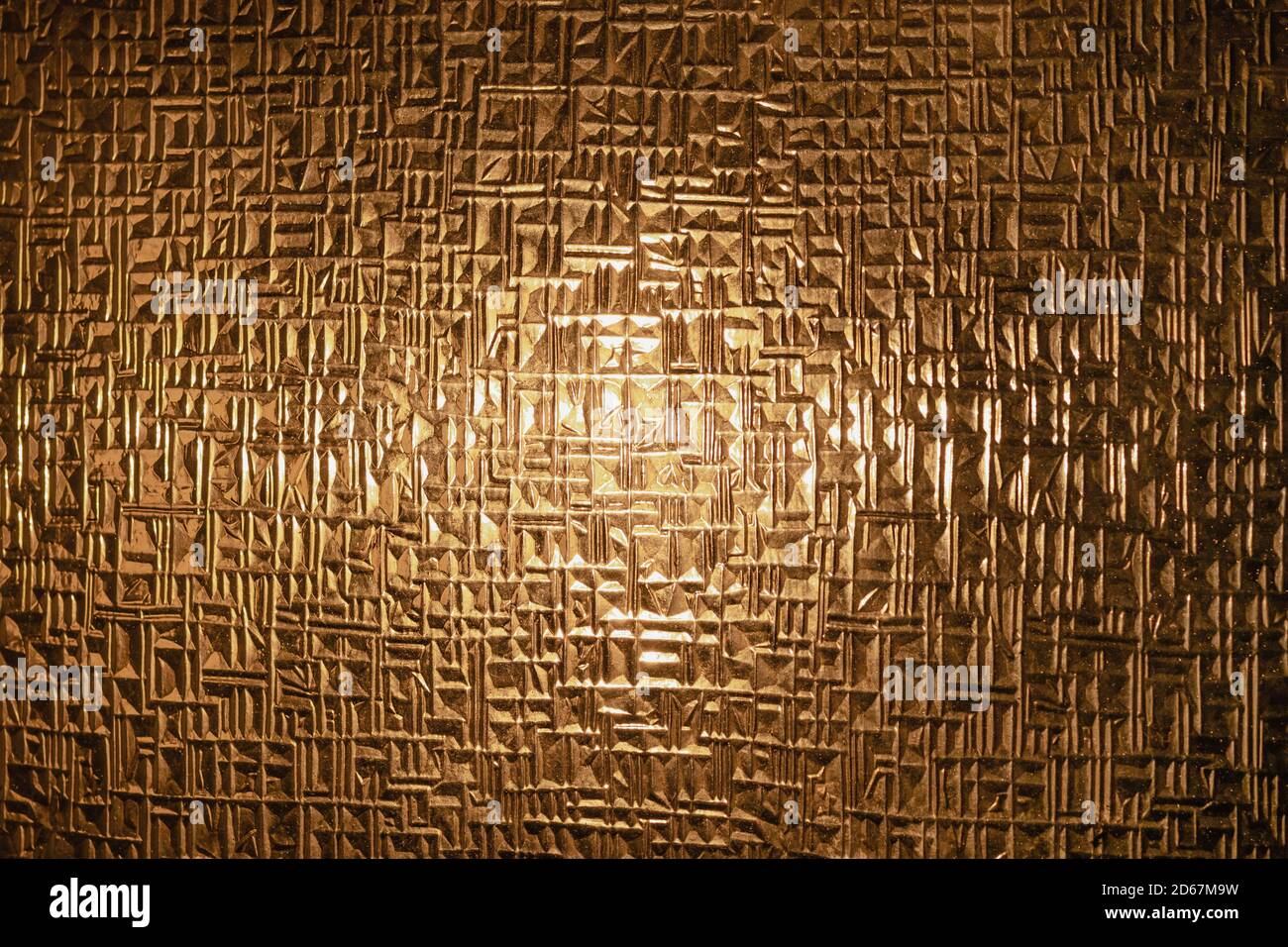 Closeup of a shining golden surface, texture for wallpaper or ...