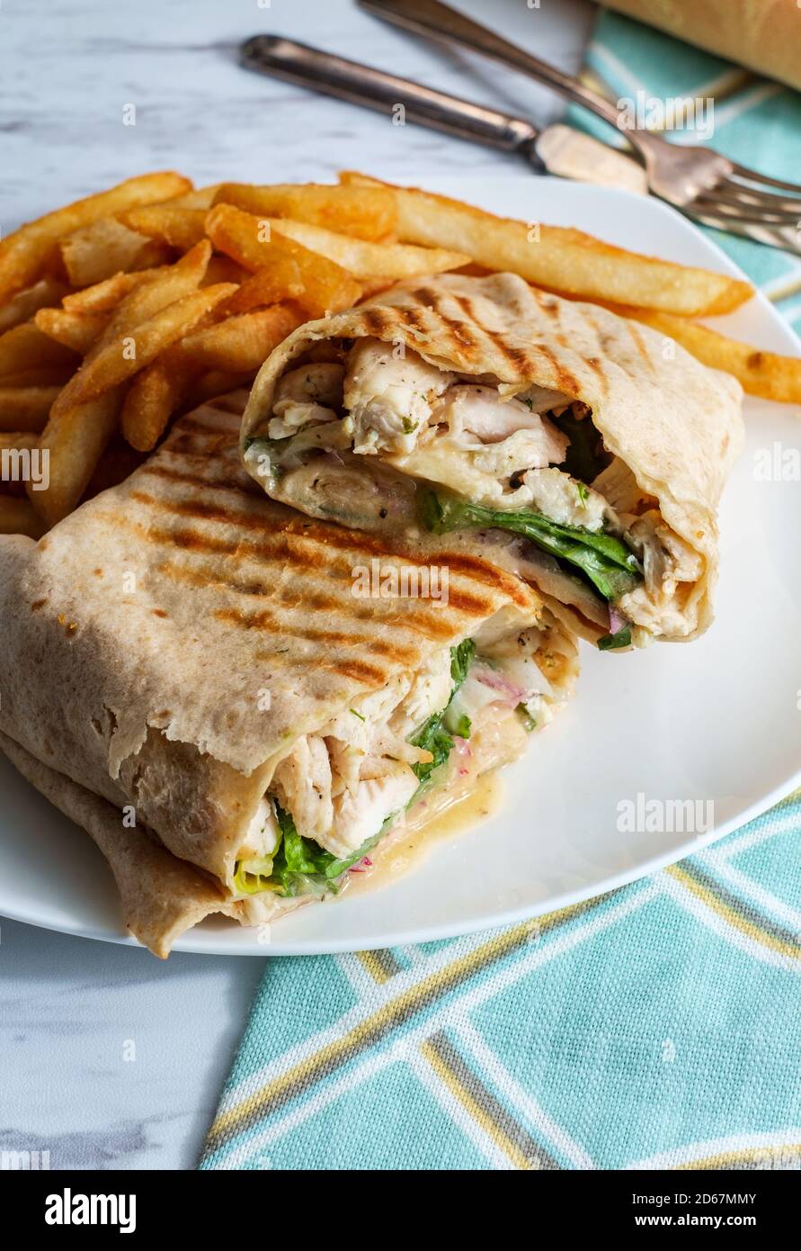 Chicken Caesar salad wrap sandwich with romaine lettuce and french ...