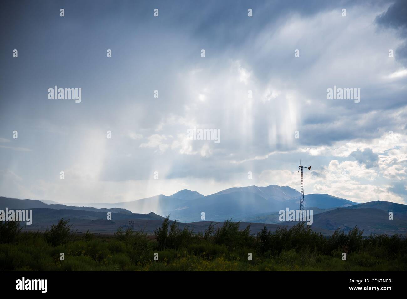 Summer rain clouds with windmill Stock Photo - Alamy
