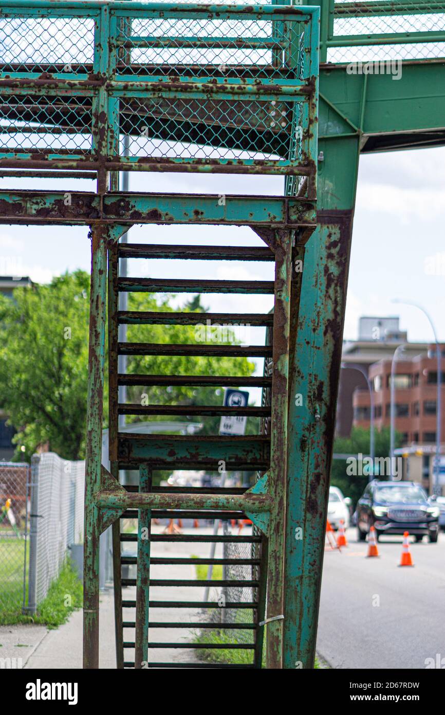 Rusted bridge overpass steps over a road Stock Photo - Alamy