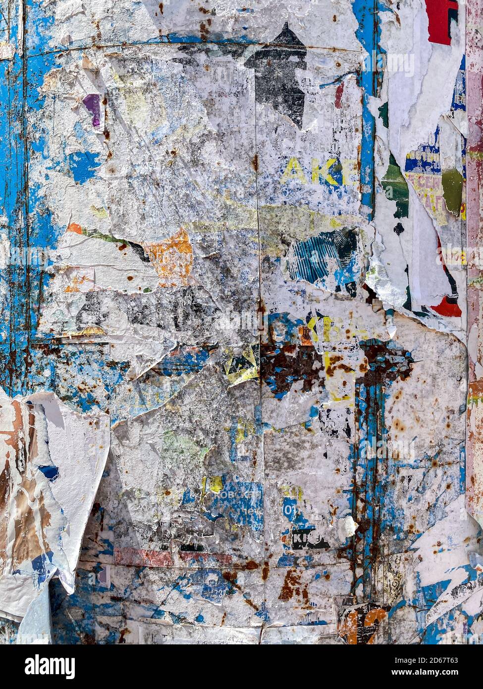 urban billboard with old torn posters. torn paper background texture ...