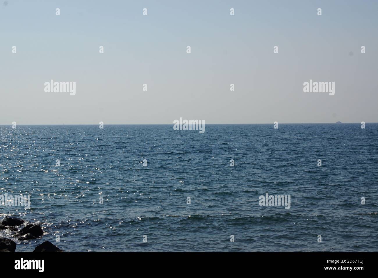 Beautiful view of the wavy ocean gleaming under the blue sky - great ...