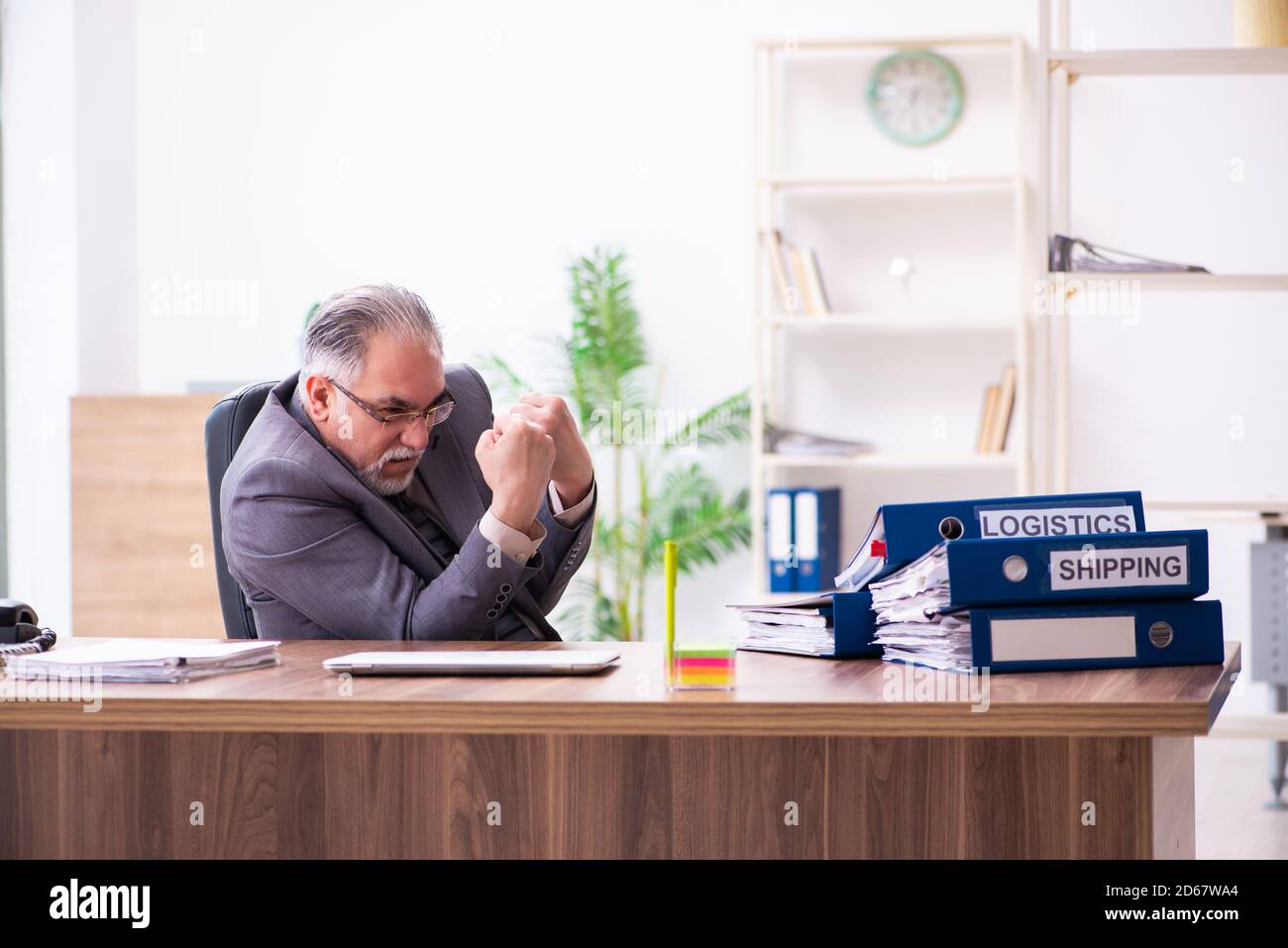 Businessman angry and furious at his workplace Stock Photo - Alamy