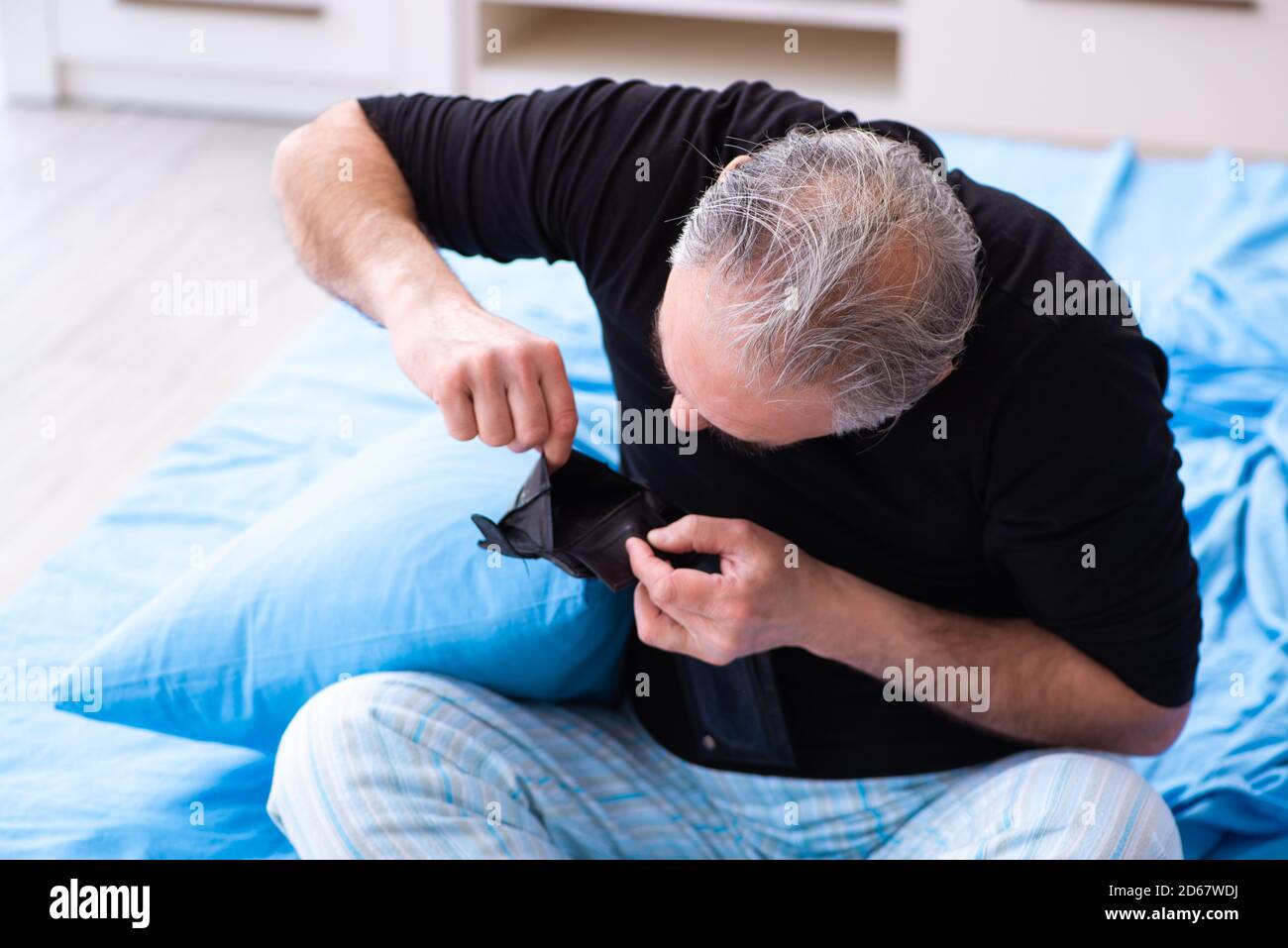 Old man in depression mode at home Stock Photo - Alamy