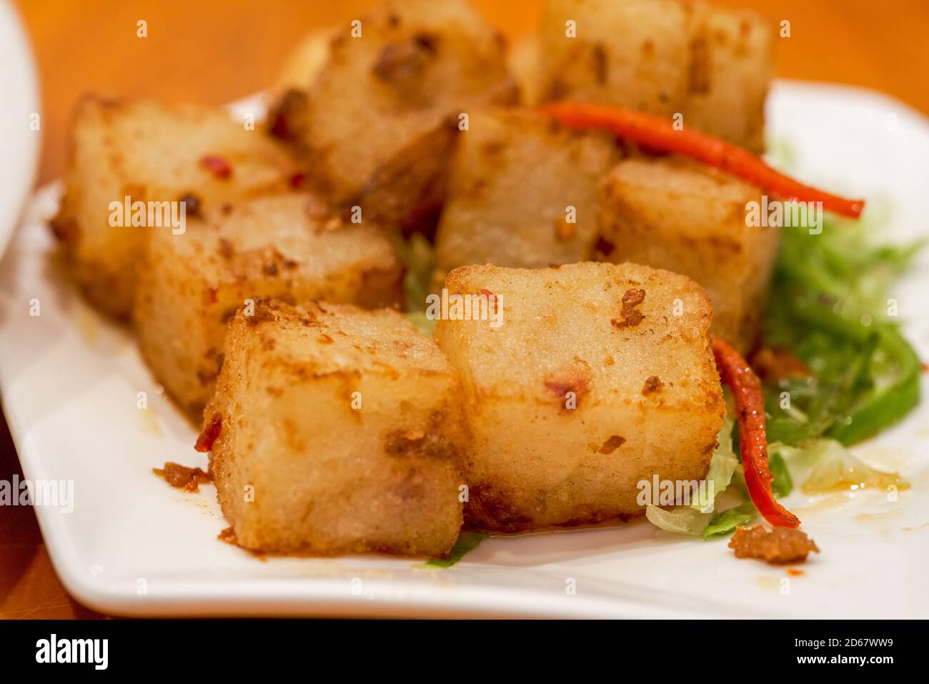 A Cantonese morning tea dim sum, fried carrot cake with XO sauce Stock ...