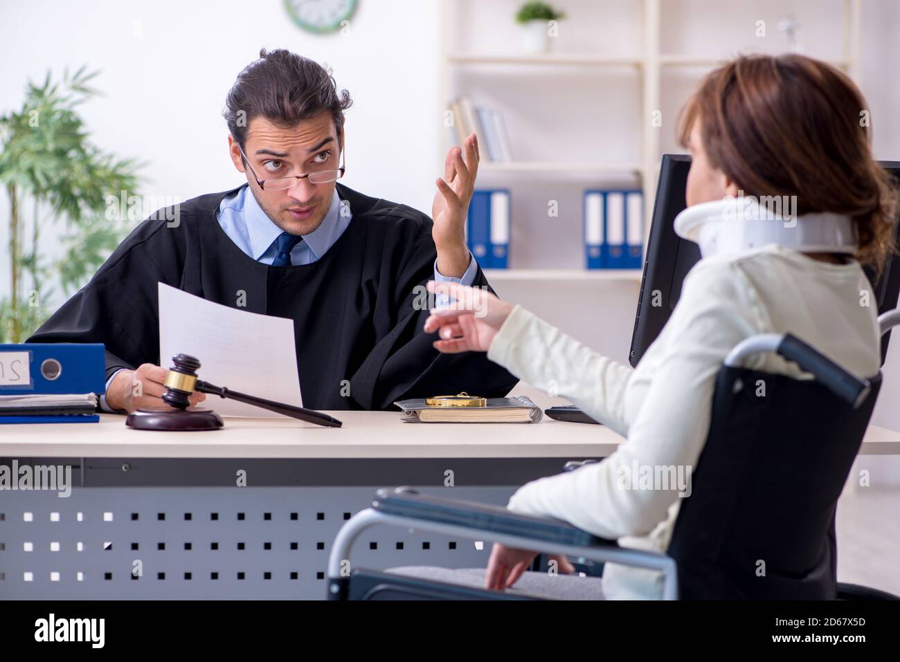 Injured woman and judge in the courtroom Stock Photo - Alamy