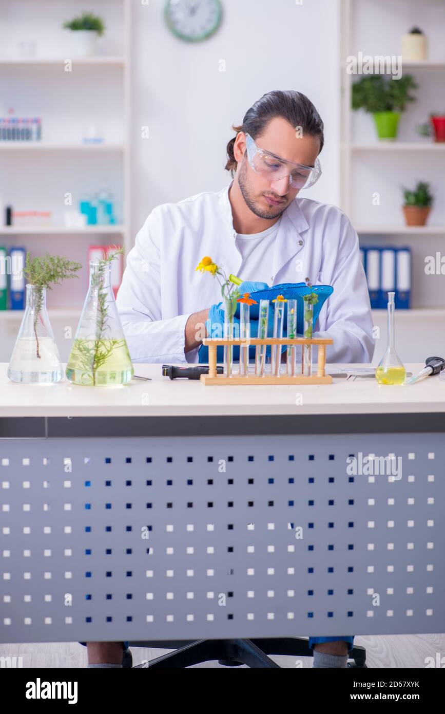 Lab researcher mixing extract liquid hi-res stock photography and ...