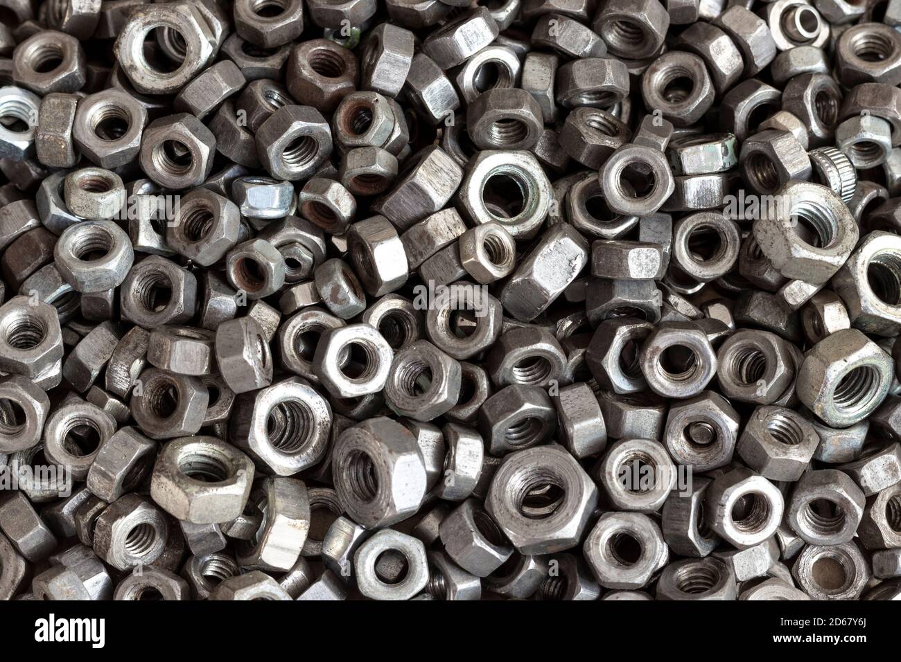 Rusty steel nuts of various sizes Stock Photo - Alamy