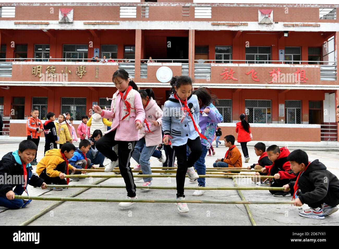 Xiangfan, China. 14th Oct, 2020. Children are playing the Chinese ...
