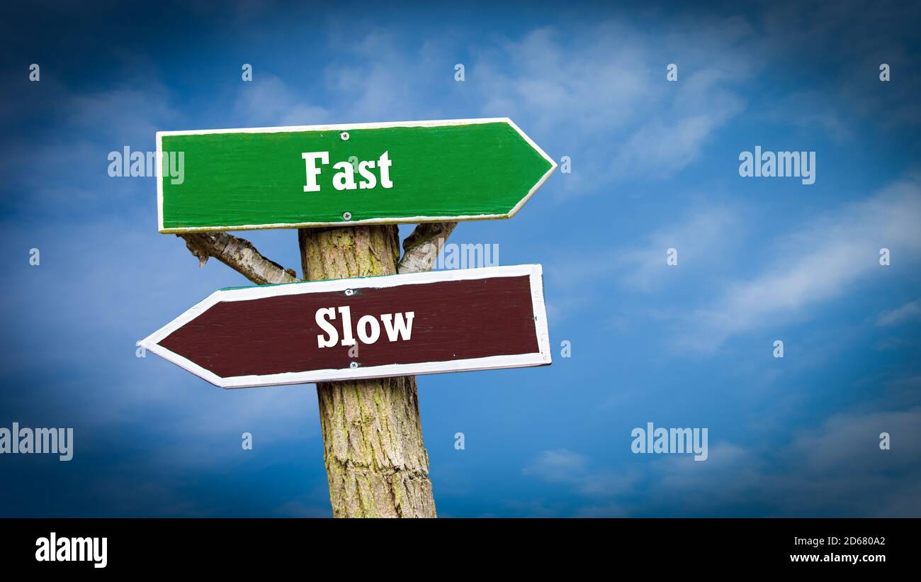 Street Sign the Direction Way to Fast versus Slow Stock Photo - Alamy