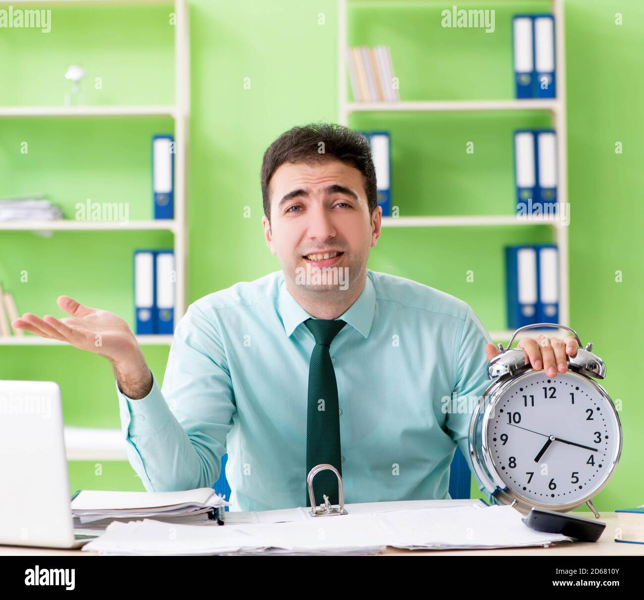 The male financial manager working in the office in time management ...