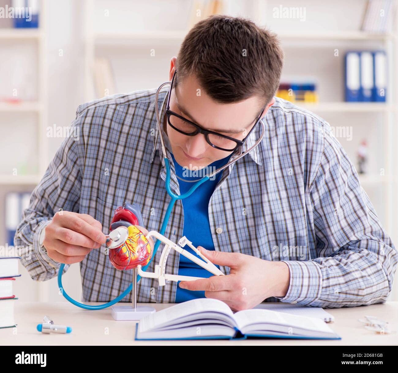 The medical student studying heart in classroom during lecture Stock ...