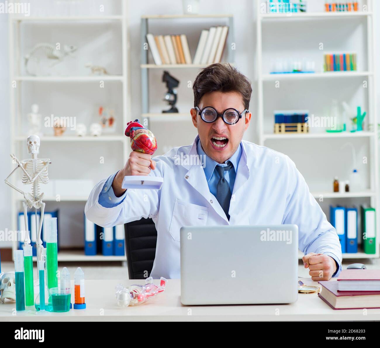 The funny doctor having fun in hospital lab Stock Photo - Alamy