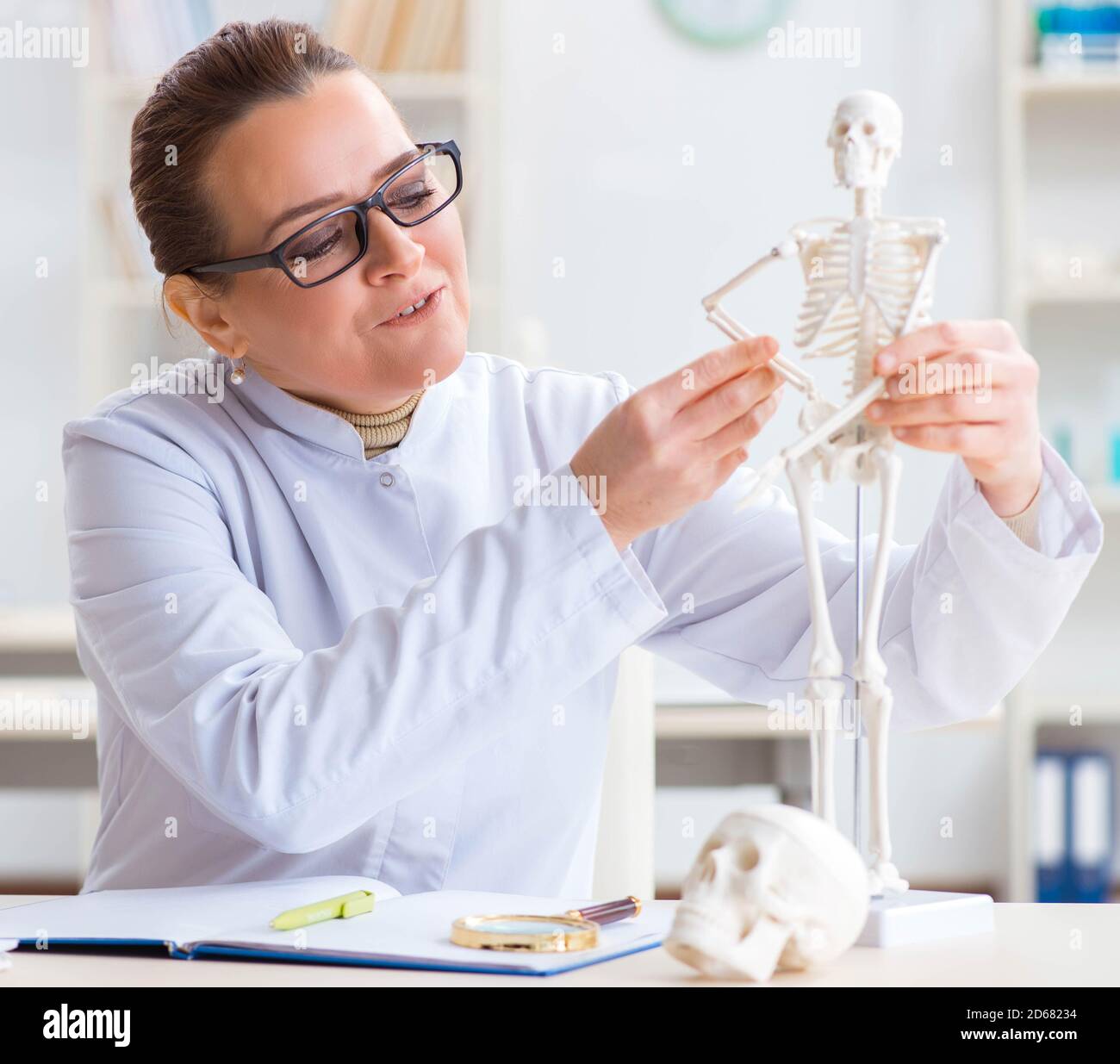 The woman doctor studying human skeleton Stock Photo - Alamy