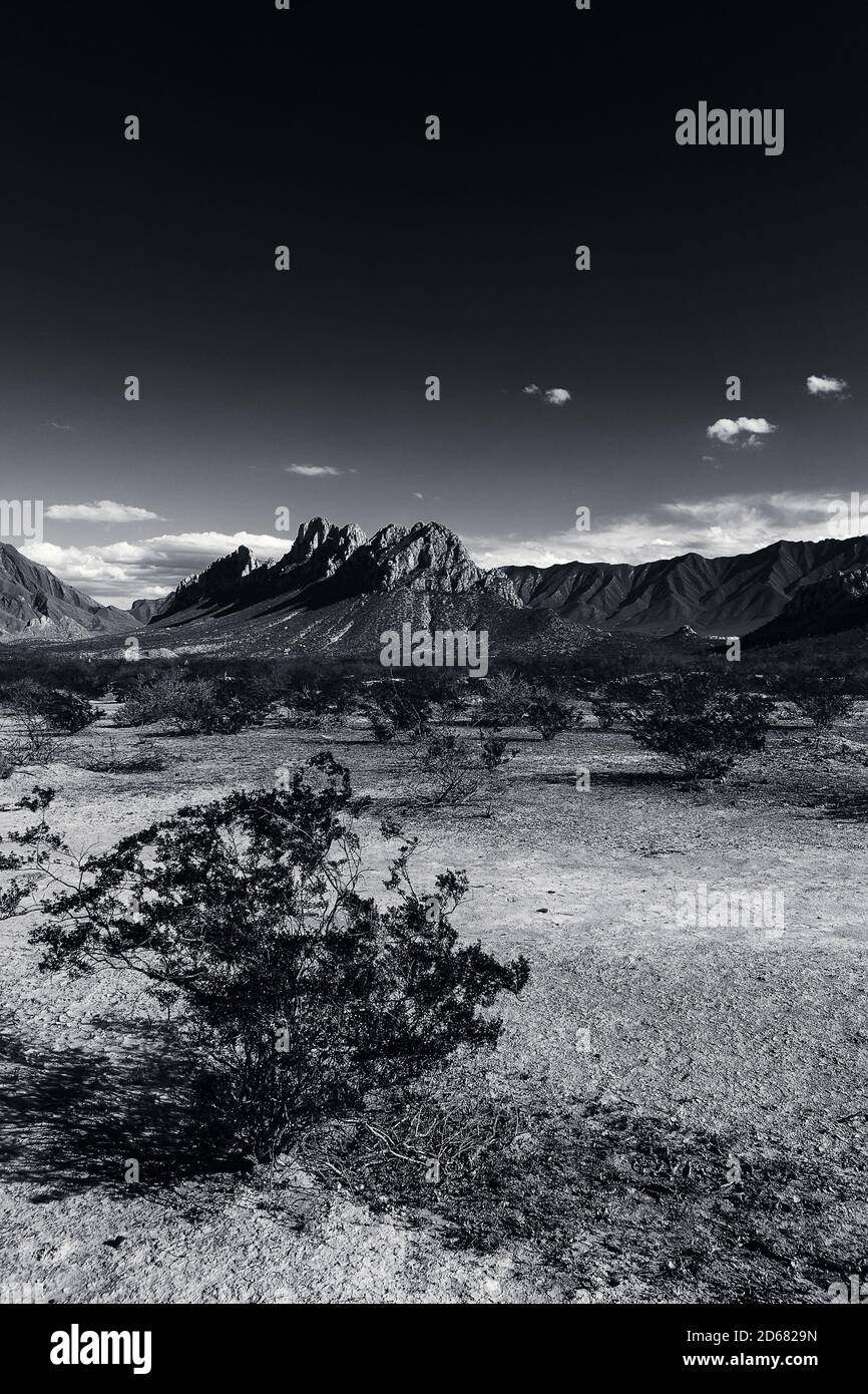 Grayscale shot of a landscape with mountains Stock Photo - Alamy