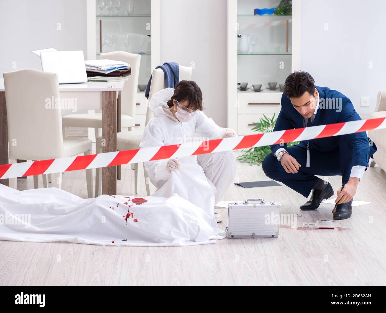 The forensics investigator at the scene of office crime Stock Photo - Alamy