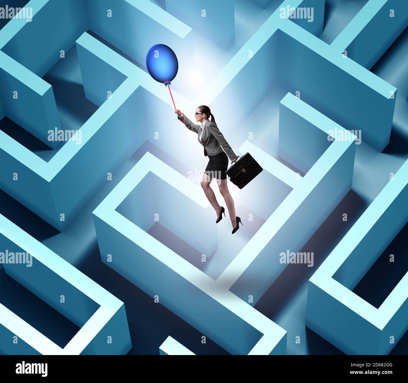 The businesswoman escaping from maze on balloon Stock Photo - Alamy