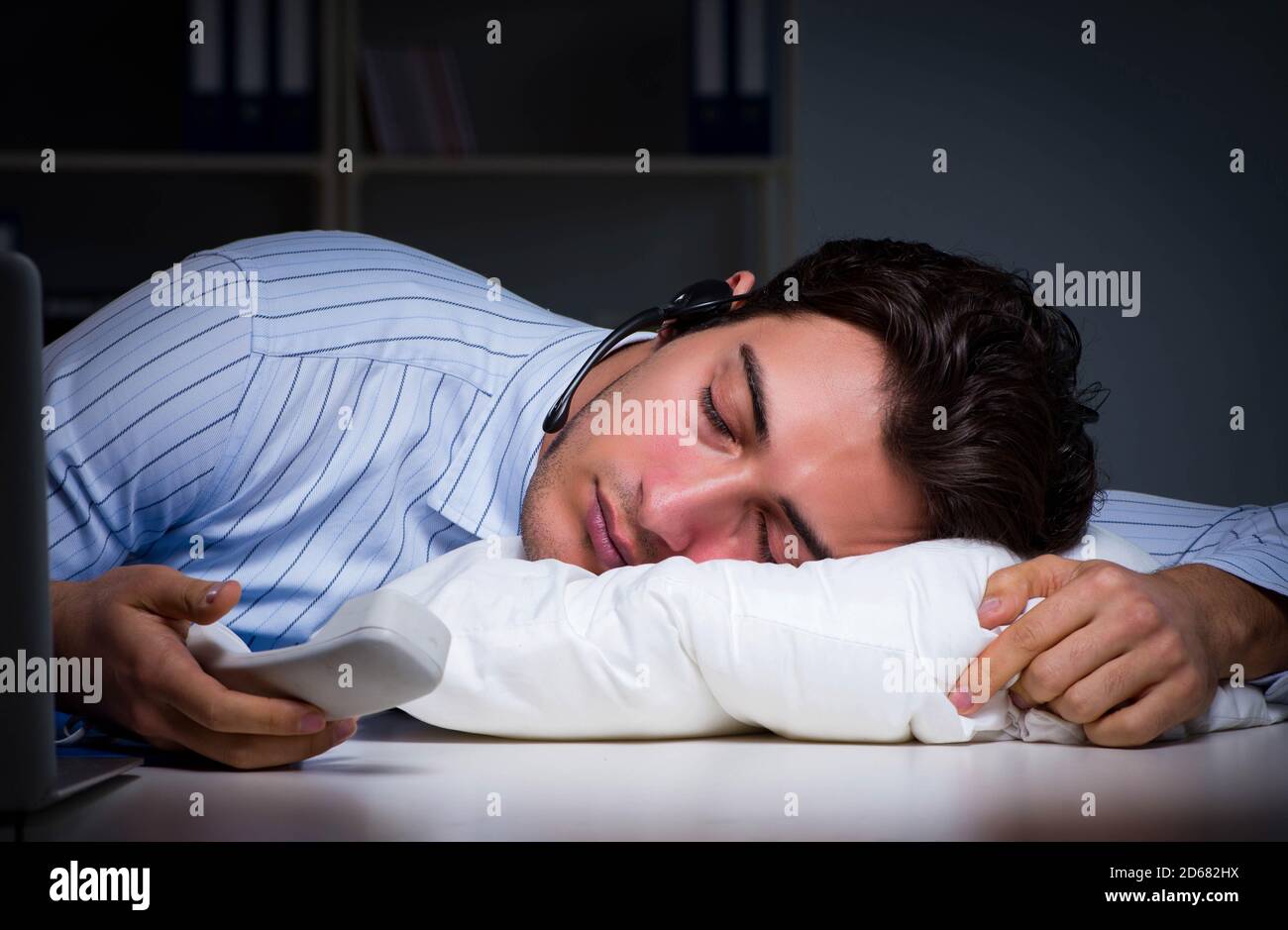 The tired and exhausted helpdesk operator during night shift Stock ...