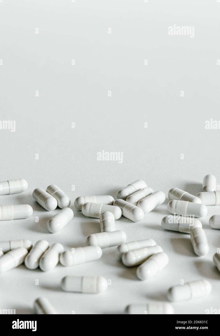White capsules background Stock Photo - Alamy