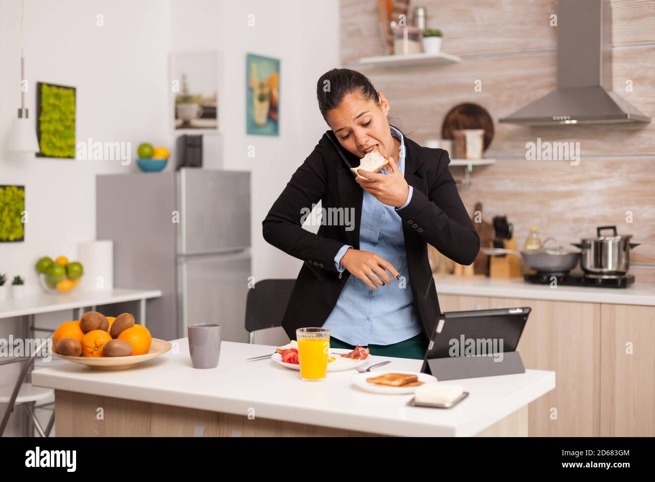 Lady working and eating breakfast hi-res stock photography and images ...