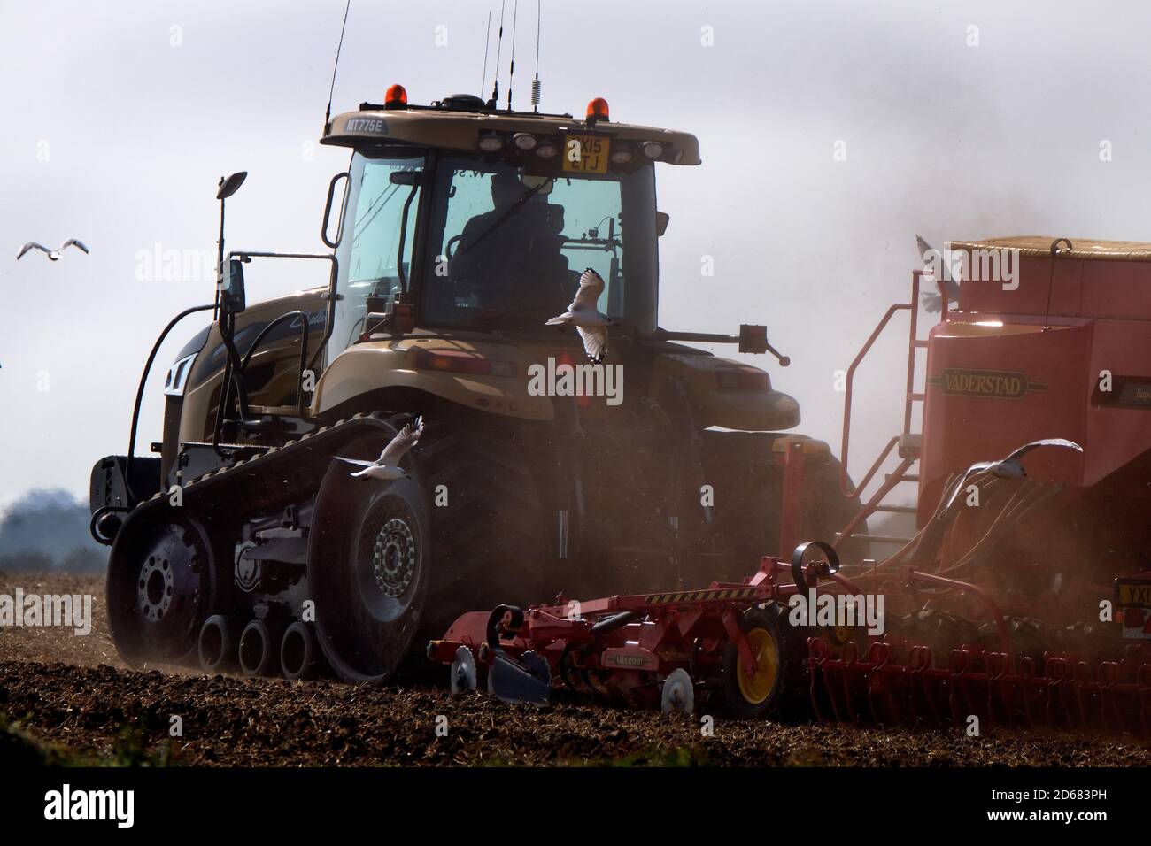 Modern large farm machinery preparing fields for new crop Stock Photo ...